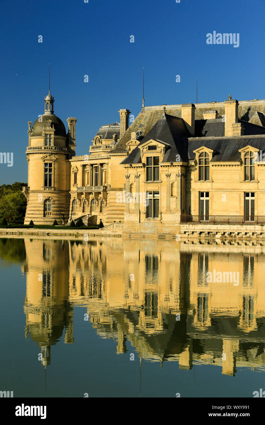 Classic Chateau de Chantilly on its lake outside Paris, France Stock ...