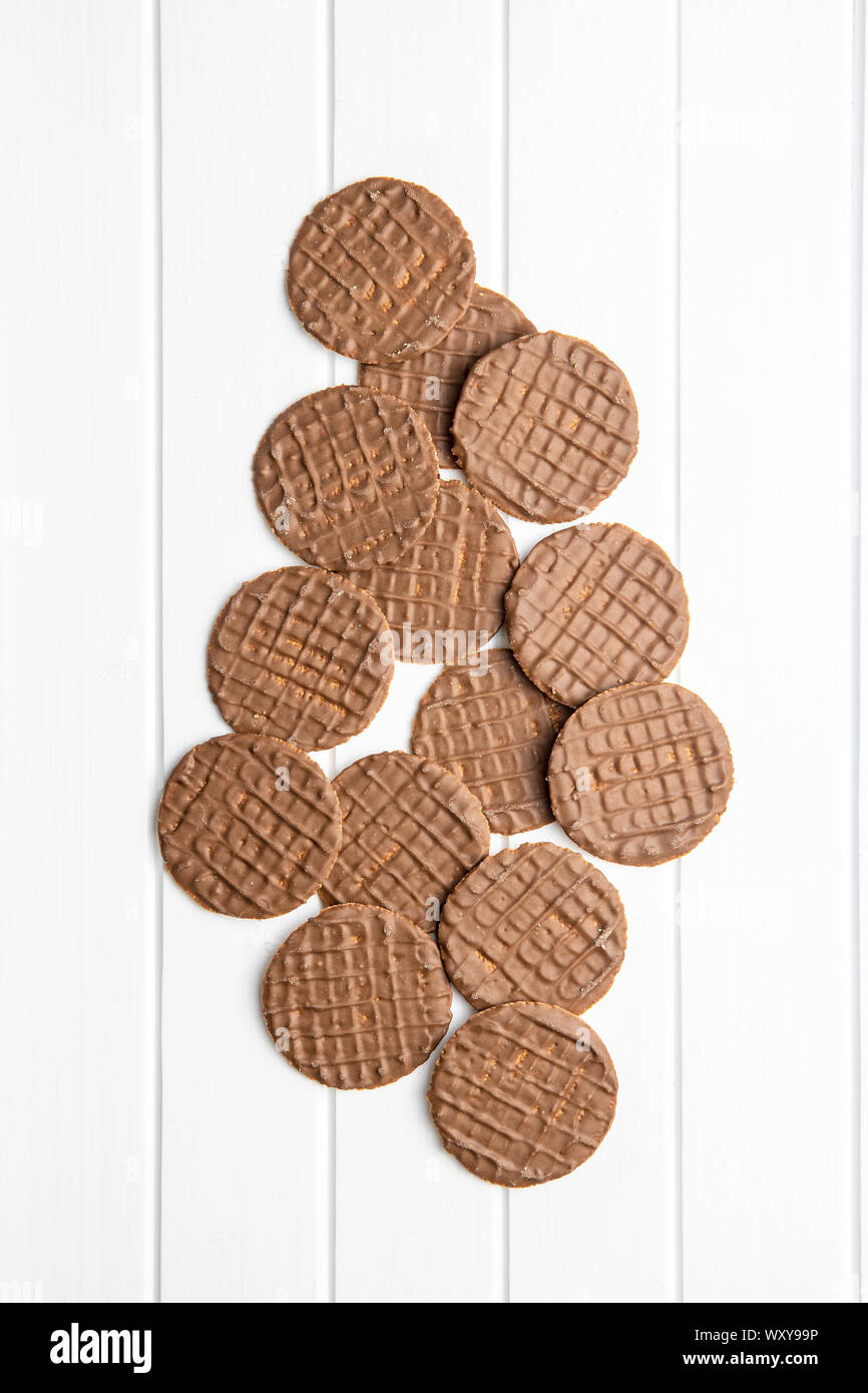 Sweet chocolate biscuits. Chocolate cookies on white table. Top view ...