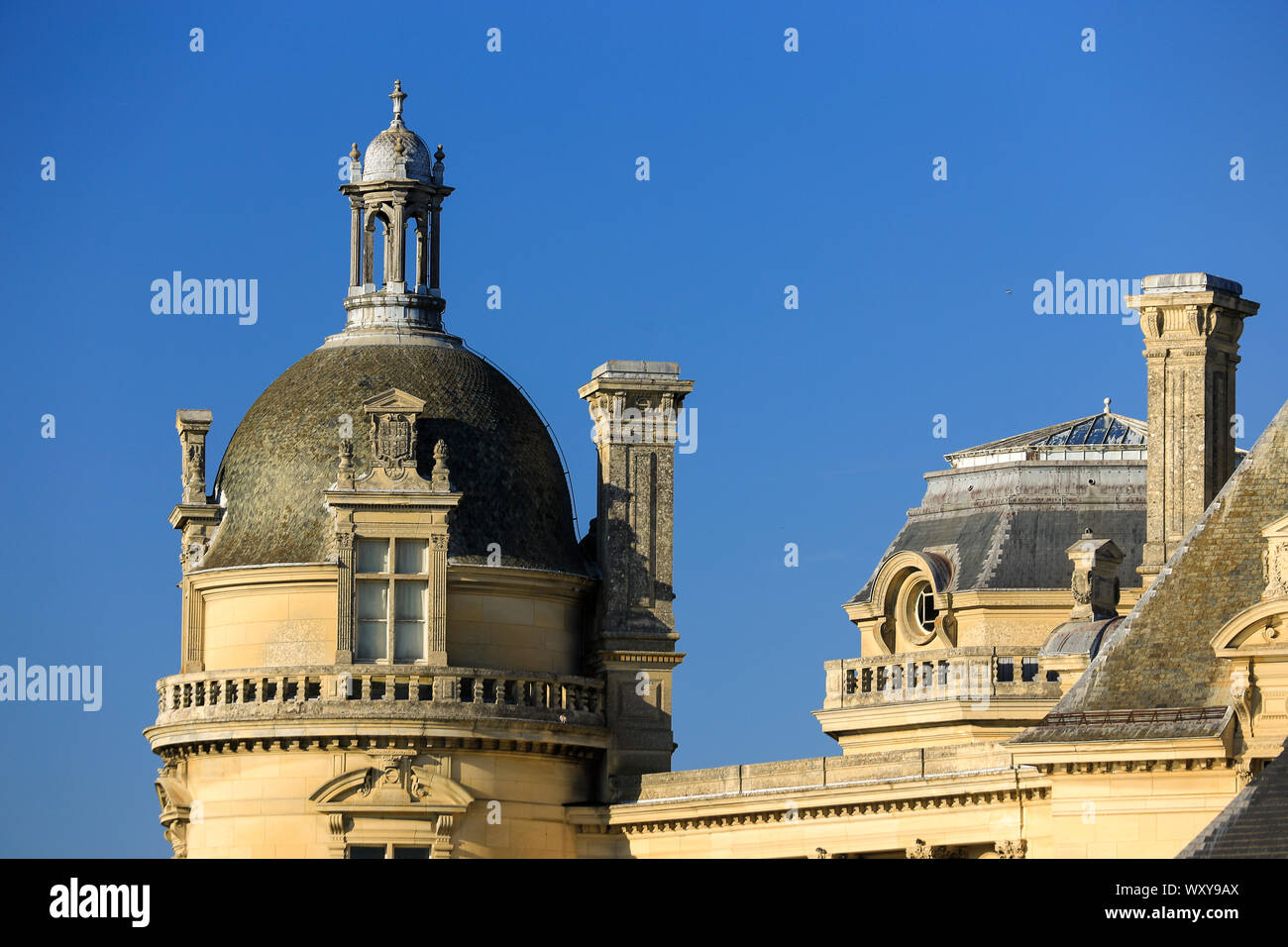 Classic Chateau de Chantilly on its lake outside Paris, France Stock ...