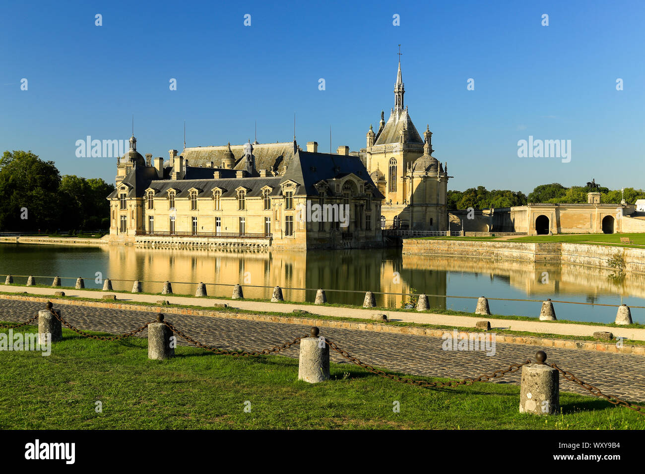 Classic Chateau de Chantilly on its lake outside Paris, France Stock ...