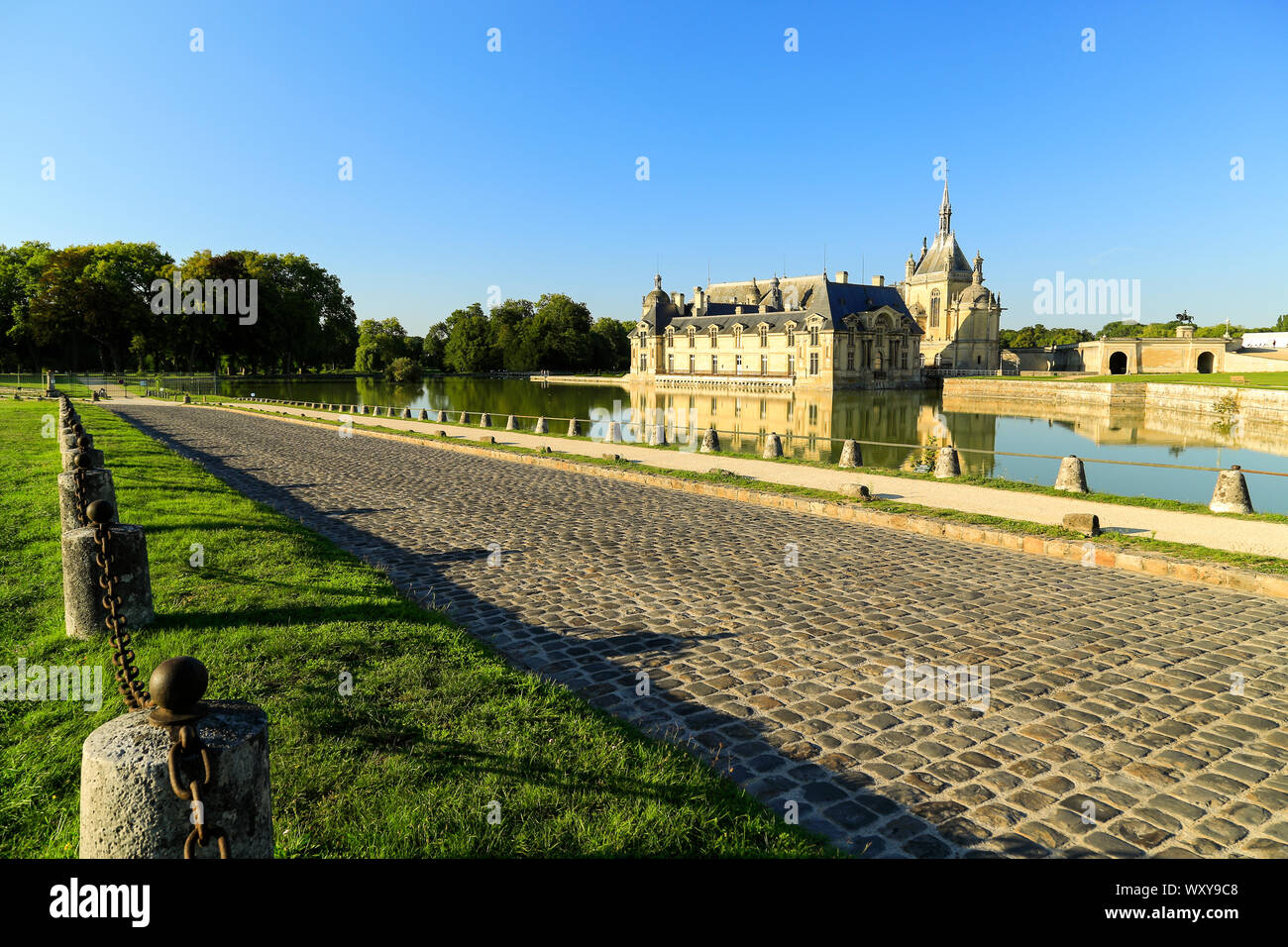 Classic Chateau de Chantilly on its lake outside Paris, France Stock ...