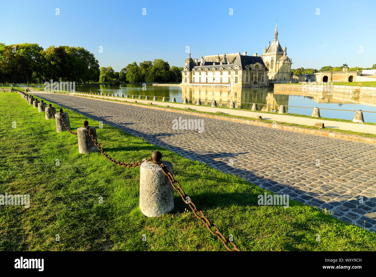 Classic Chateau de Chantilly on its lake outside Paris, France Stock ...