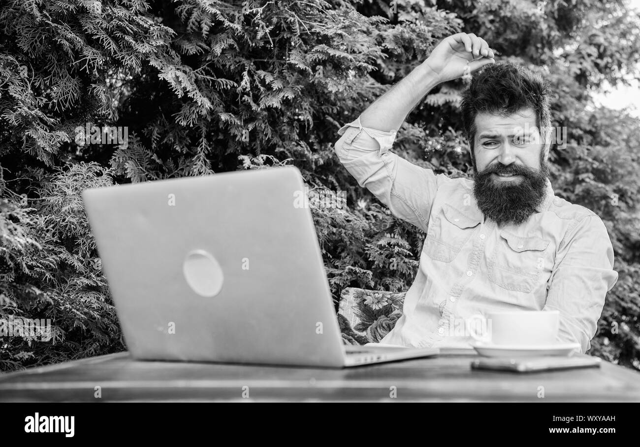 Write article for online magazine. Bearded hipster laptop surfing ...