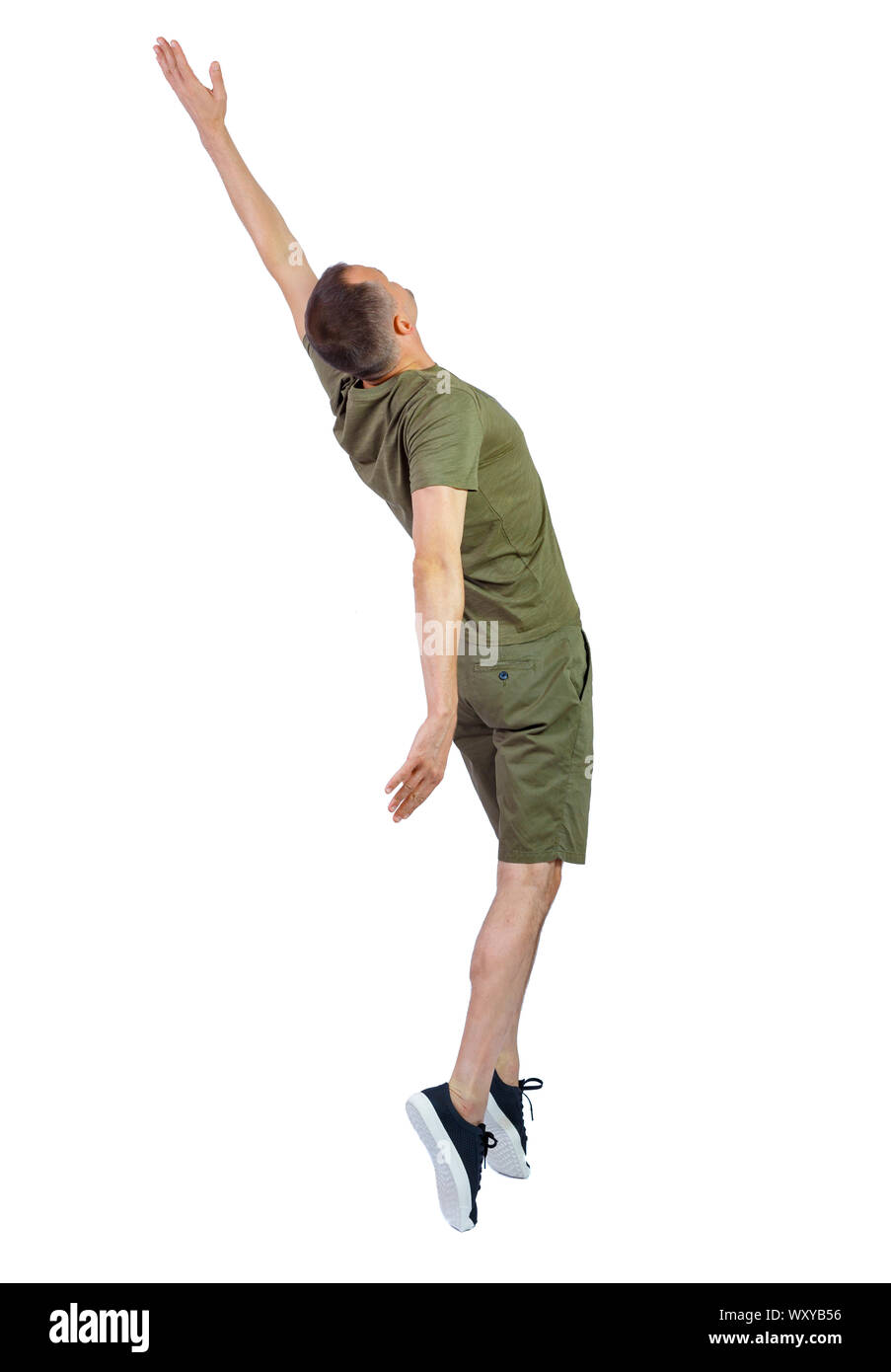 Side view of a man dancing in shorts. The guy is balancing. Rear view ...