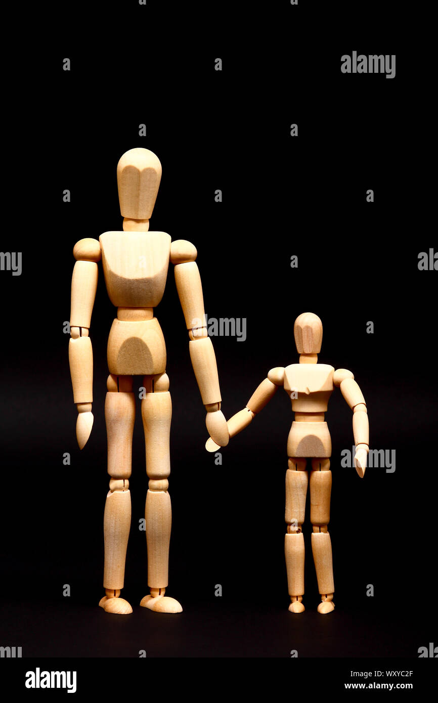 Conceptual image of a manikin parent and child holding hands Stock ...