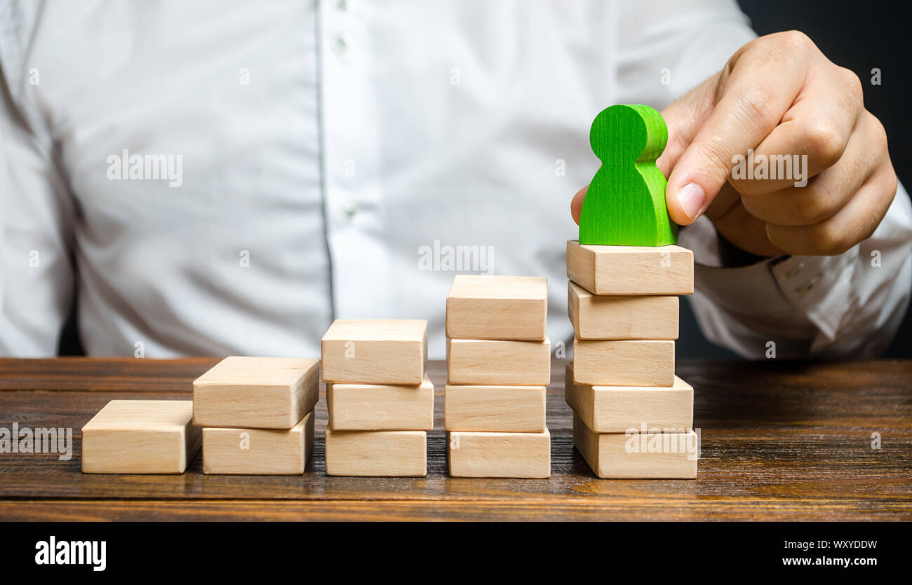 Businessman promotes employee on the career ladder. Promotion of a ...