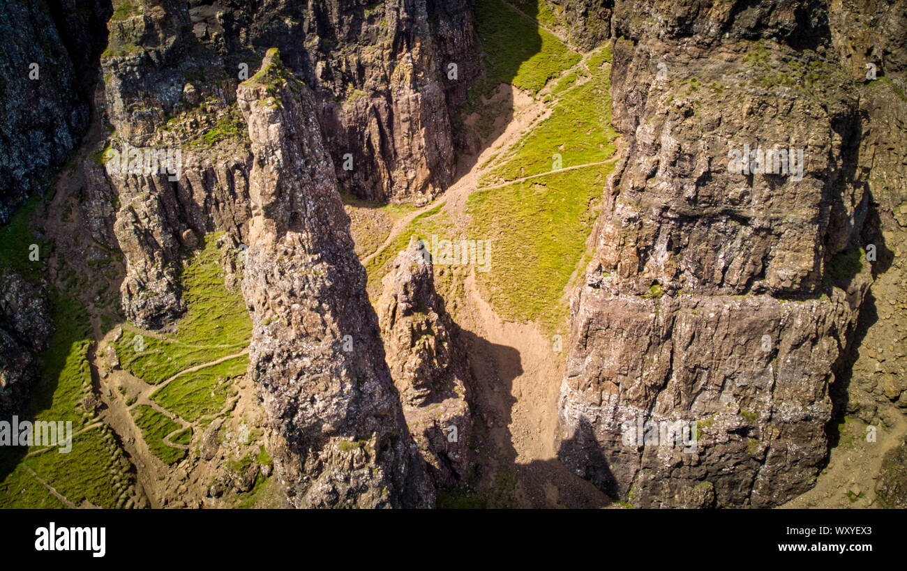 Aerial view of Needle Rock, Quiraing. Vertical pillar against the green ...