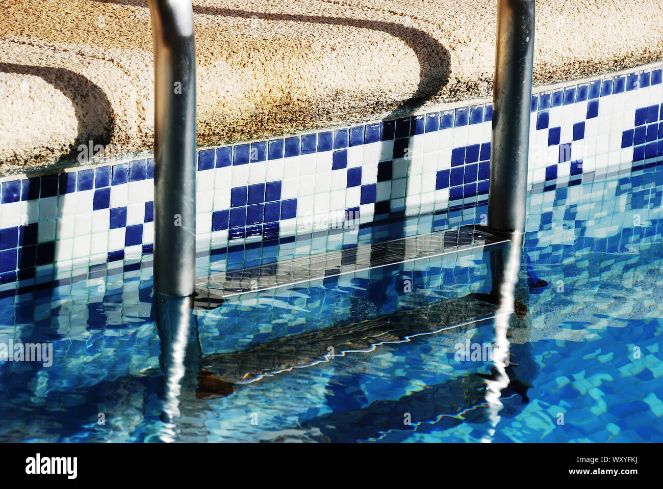 Swimming pool steps Stock Photo - Alamy