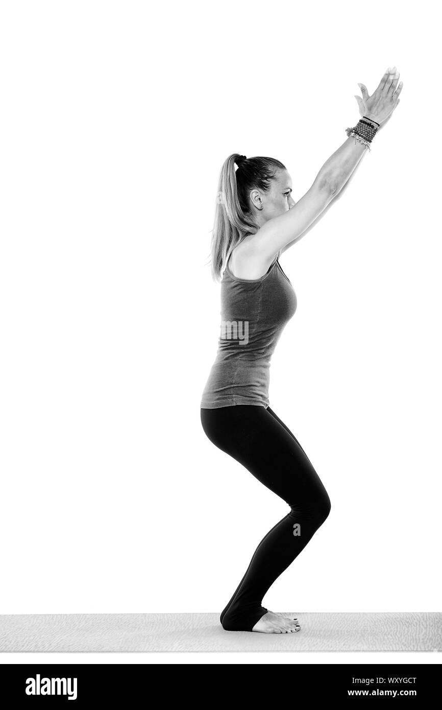 Woman yoga teacher in various poses (asana) isolated on white ...