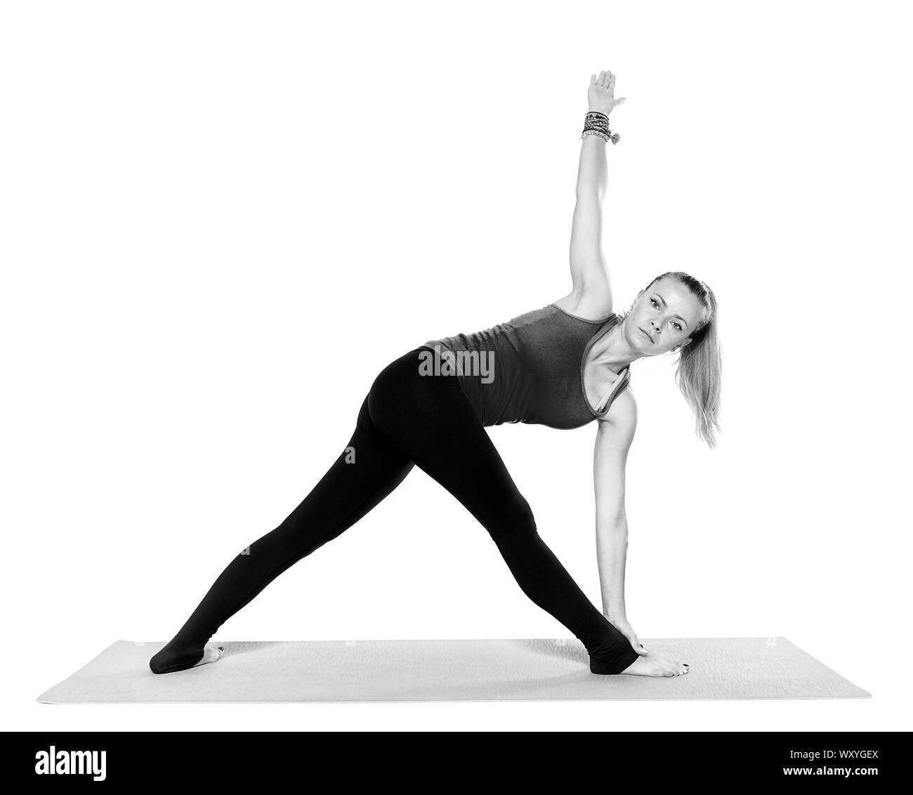 Woman yoga teacher in various poses (asana) isolated on white ...