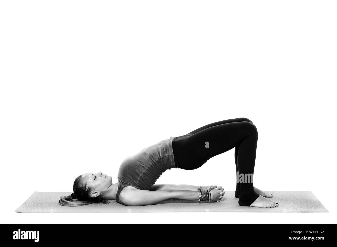 Woman yoga teacher in various poses (asana) isolated on white ...