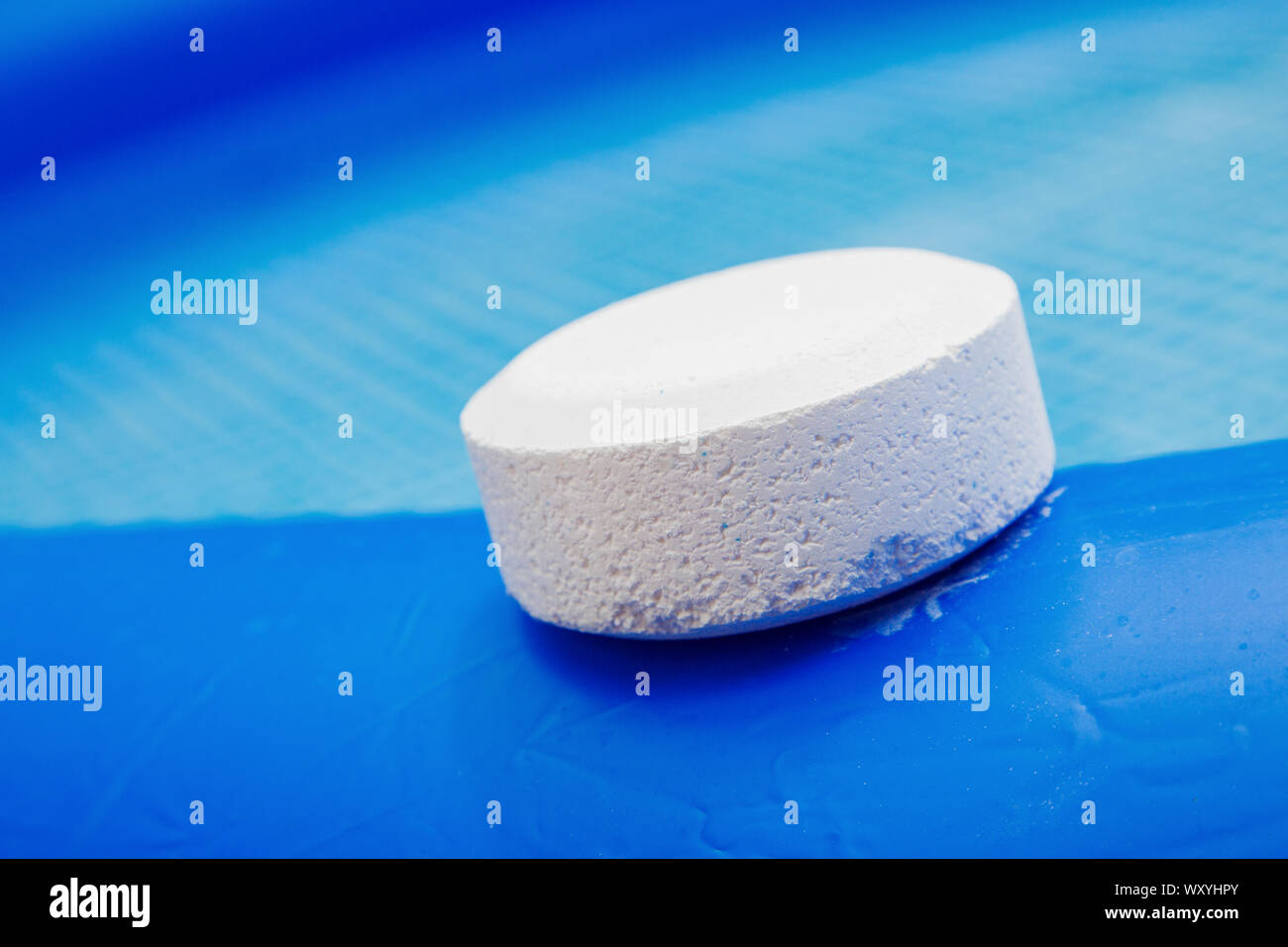 Chlorine Pellets on the edge of an inflatable pool Stock Photo - Alamy