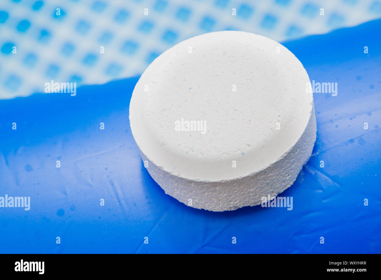Chlorine Pellets on the edge of an inflatable pool Stock Photo - Alamy