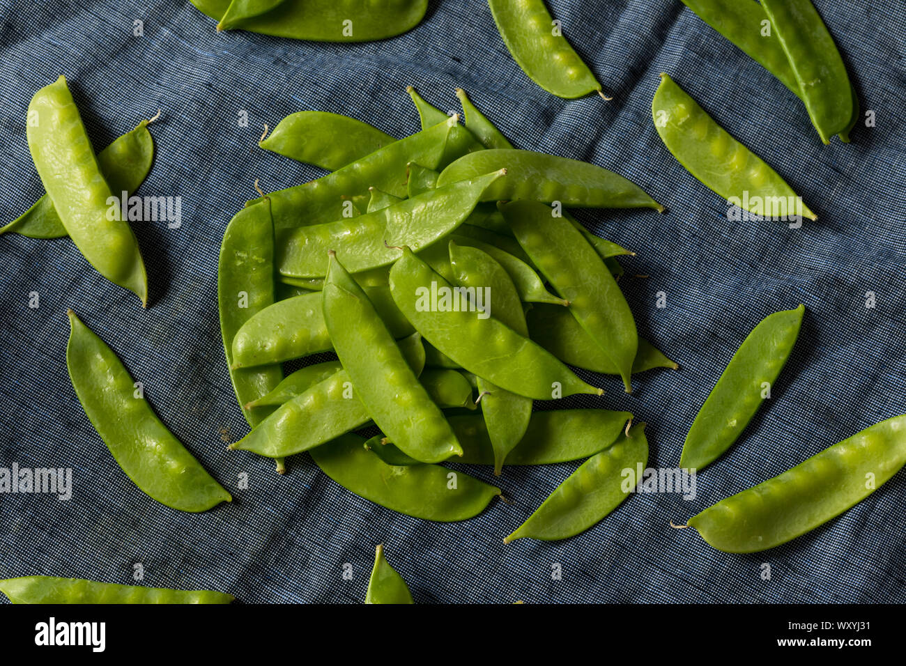 Raw Green Organic Snow Peas in a Heap Stock Photo - Alamy