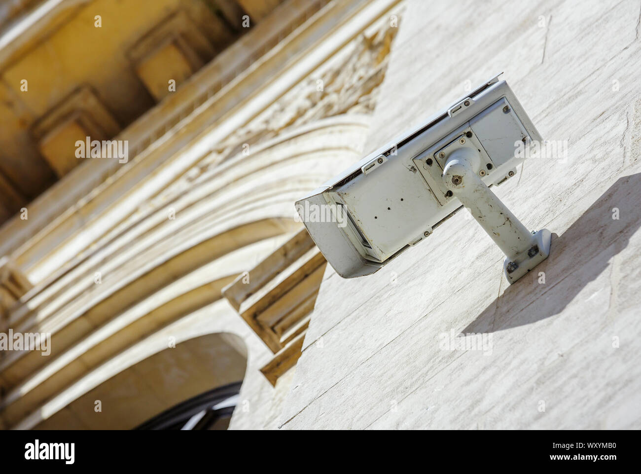 security CCTV camera or surveillance system fixed on old construction ...