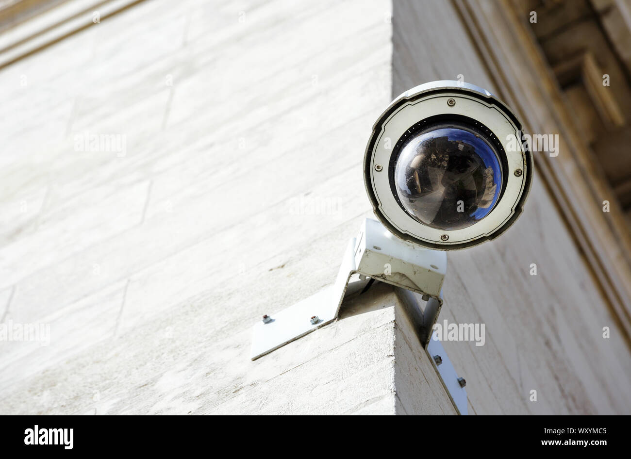 security CCTV camera or surveillance system fixed on old construction ...