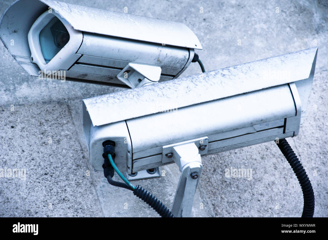 Two urban security cameras Stock Photo - Alamy