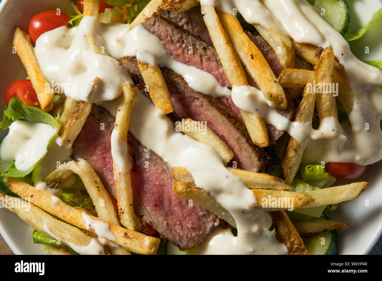 Homemade Pittsburgh Salad with Steak and French Fries Stock Photo - Alamy