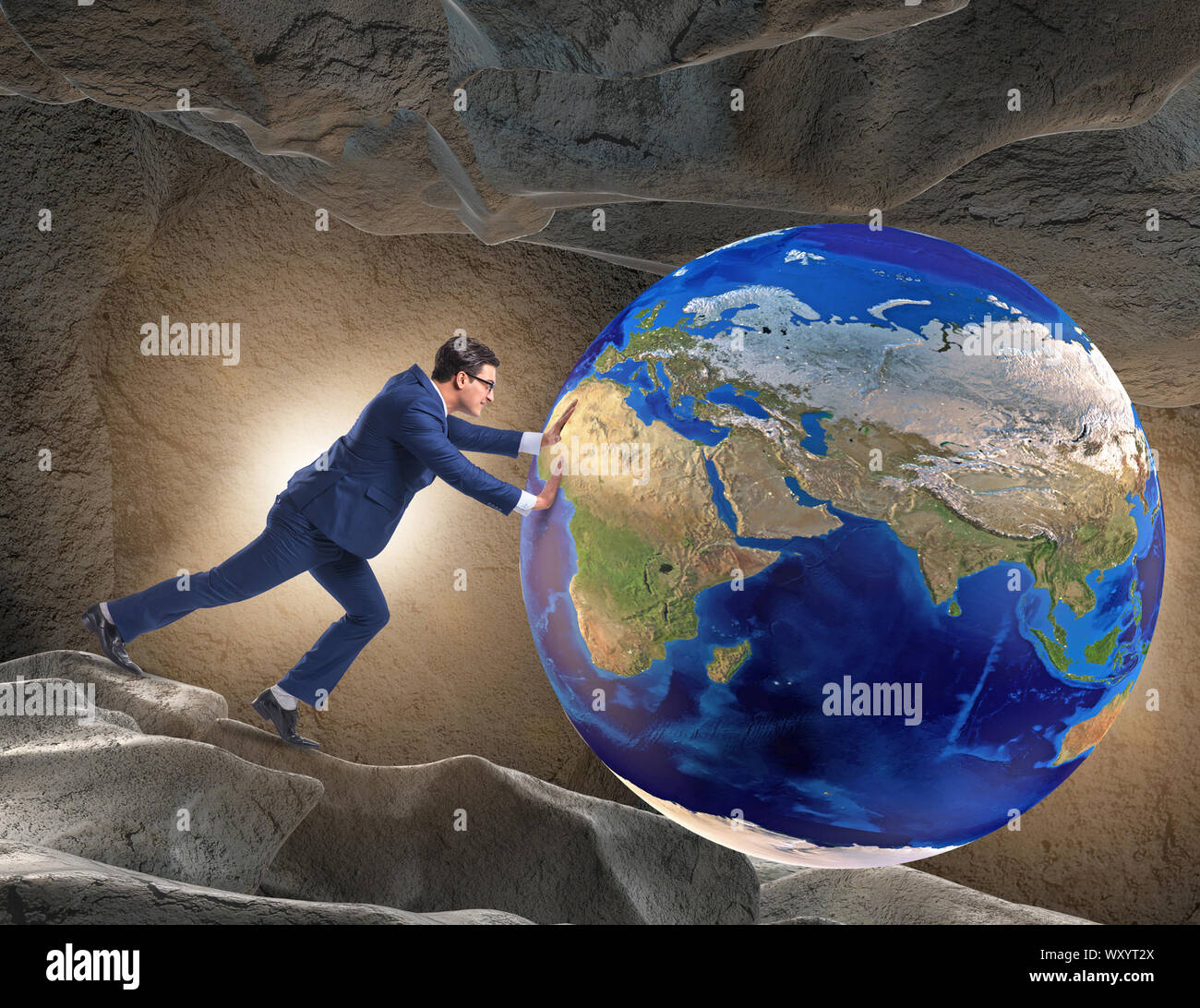 The businessman pushing the world in challenge concept Stock Photo - Alamy