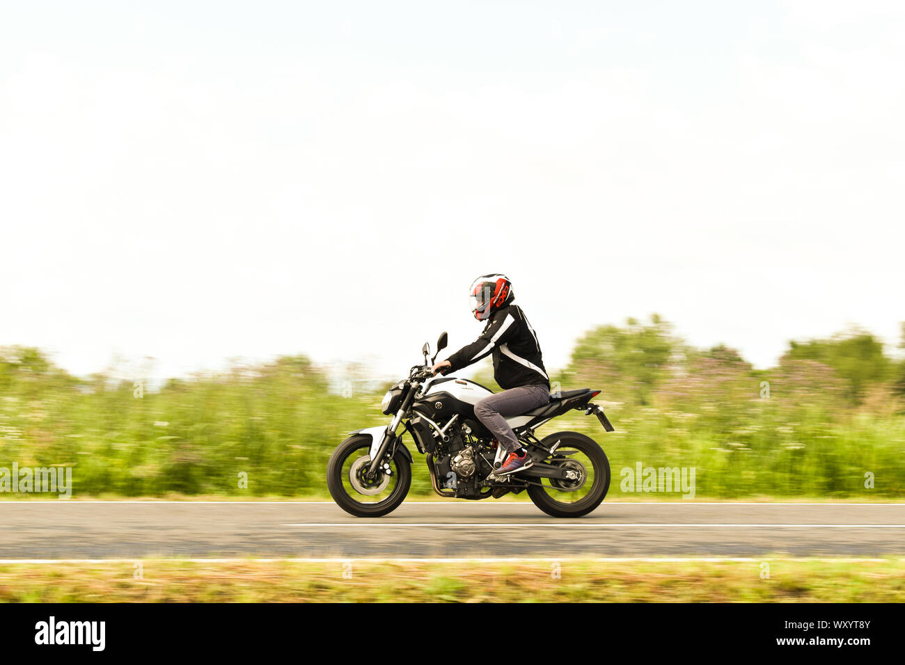 Biker with green jacket hi-res stock photography and images - Alamy