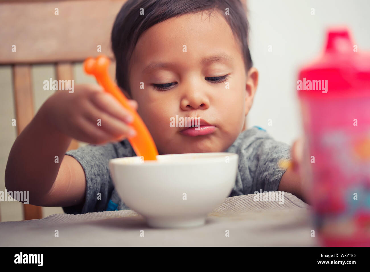 Infant learning eat spoon hi-res stock photography and images - Alamy