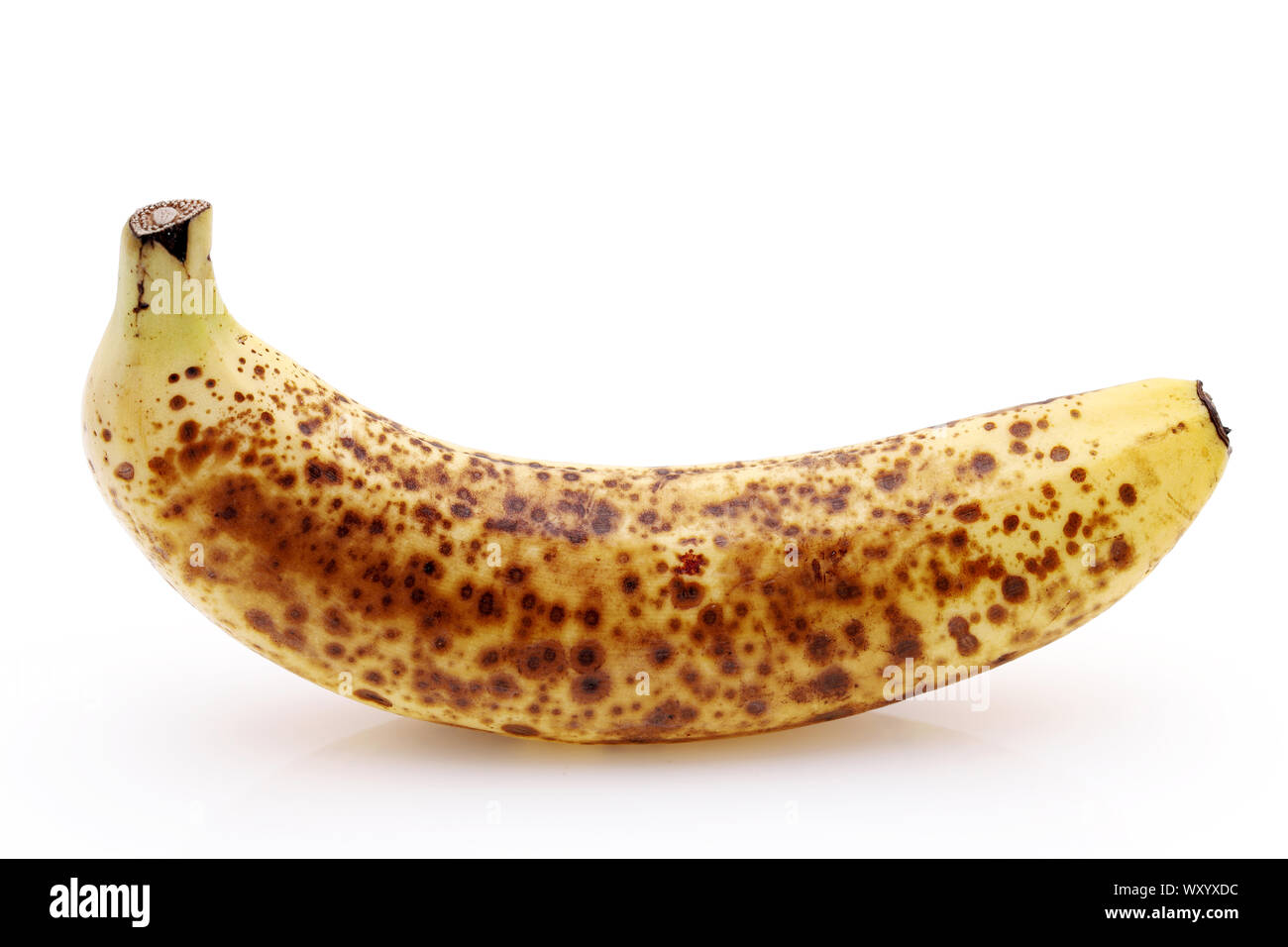 Close up of an over-ripe banana isolated on white background Stock ...