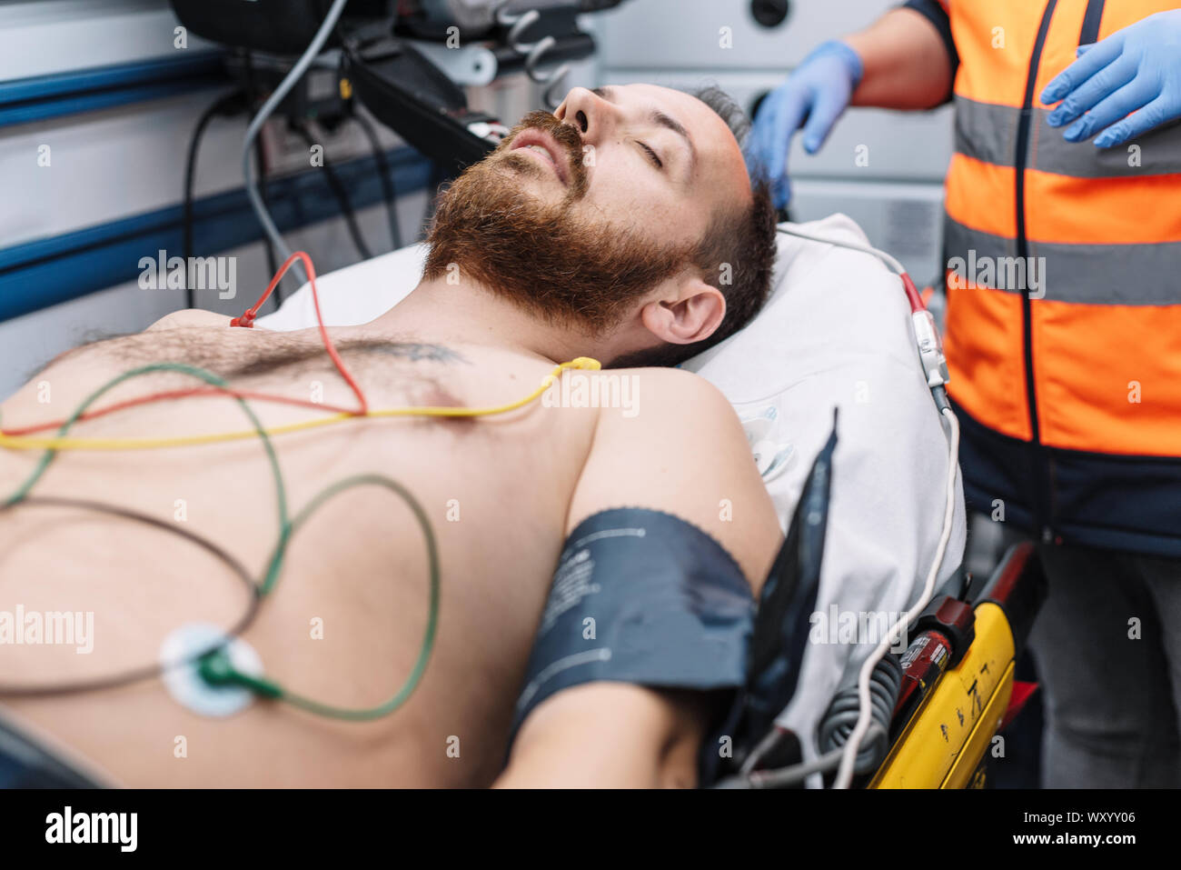 Paramedic attending to patient in ambulance Stock Photo - Alamy