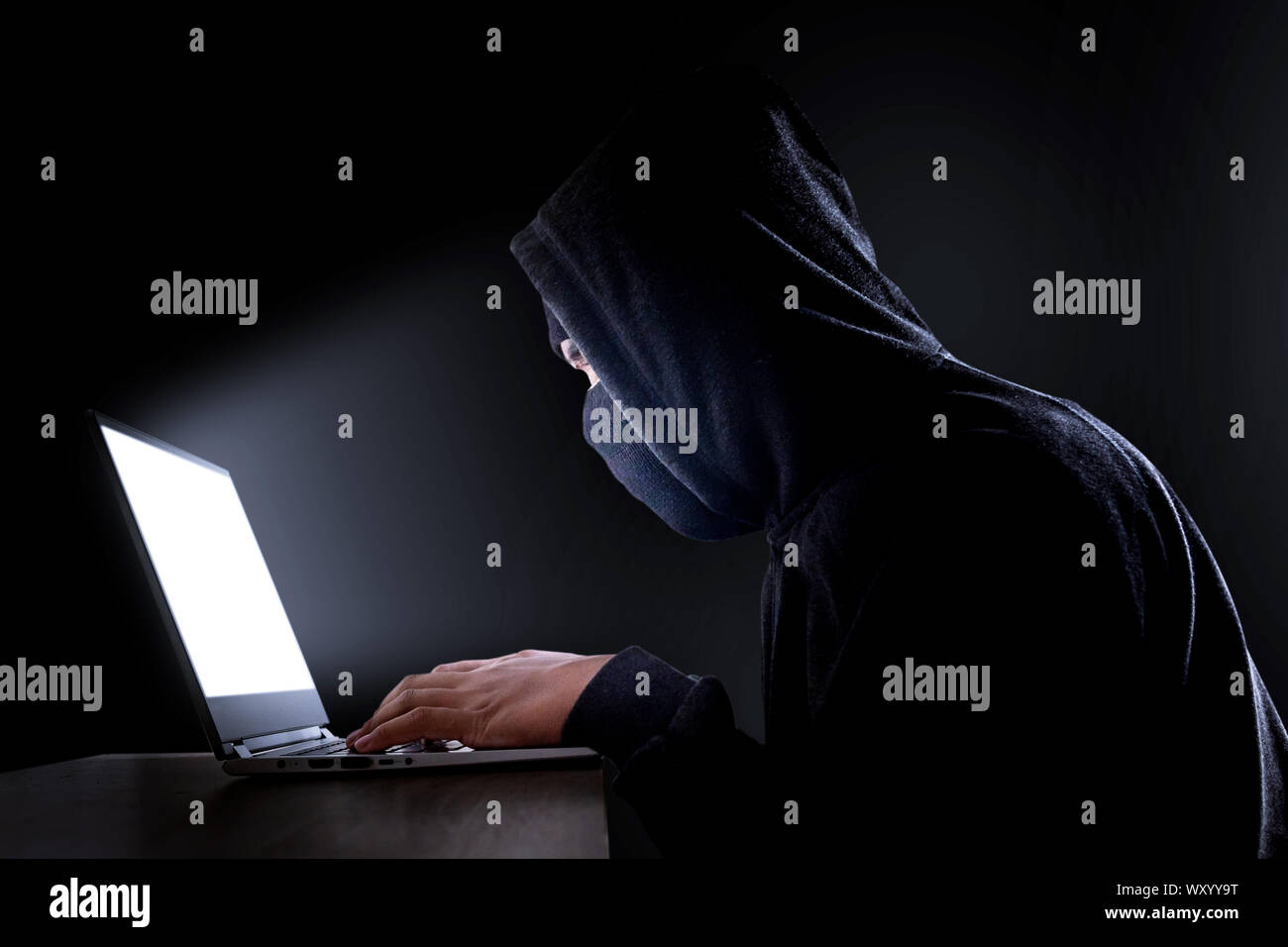 Cybercrime, hacking and technology crime. hacker with laptop. with ...