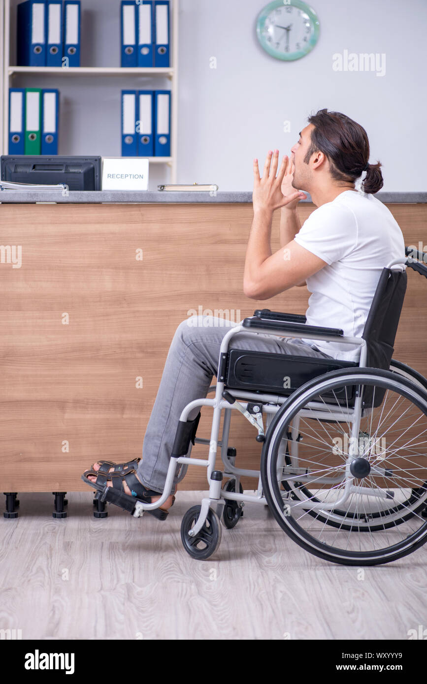 Clinic reception counter and young patient Stock Photo - Alamy