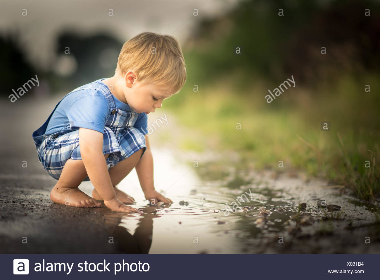 Boy In Puddle High Resolution Stock Photography and Images - Alamy