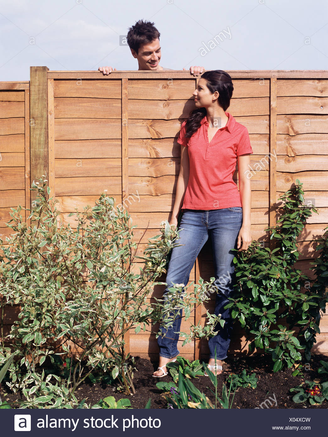 Two People Talking Over The Fence High Resolution Stock Photography and ...