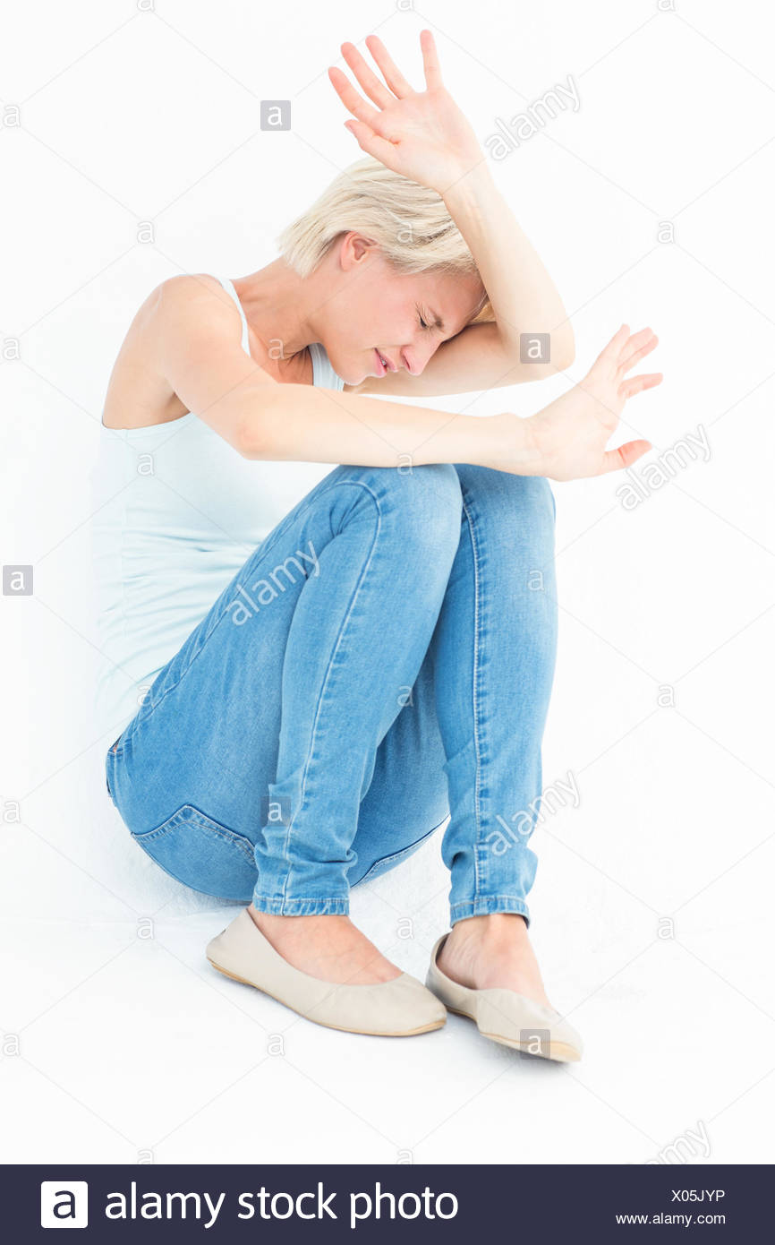 Woman Crouching Scared High Resolution Stock Photography and Images - Alamy