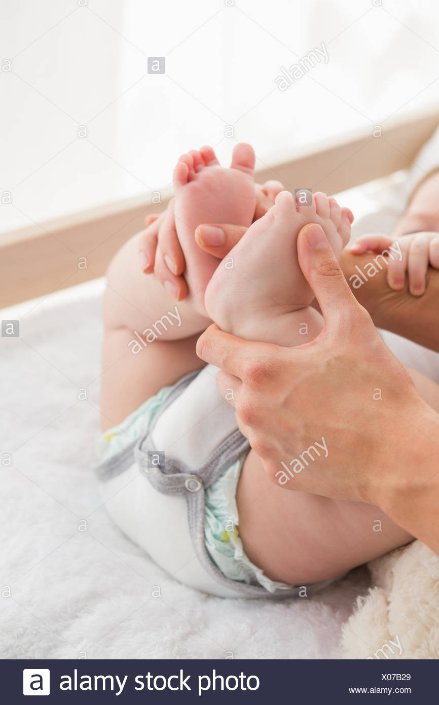 Mother Tickling Baby High Resolution Stock Photography and Images - Alamy