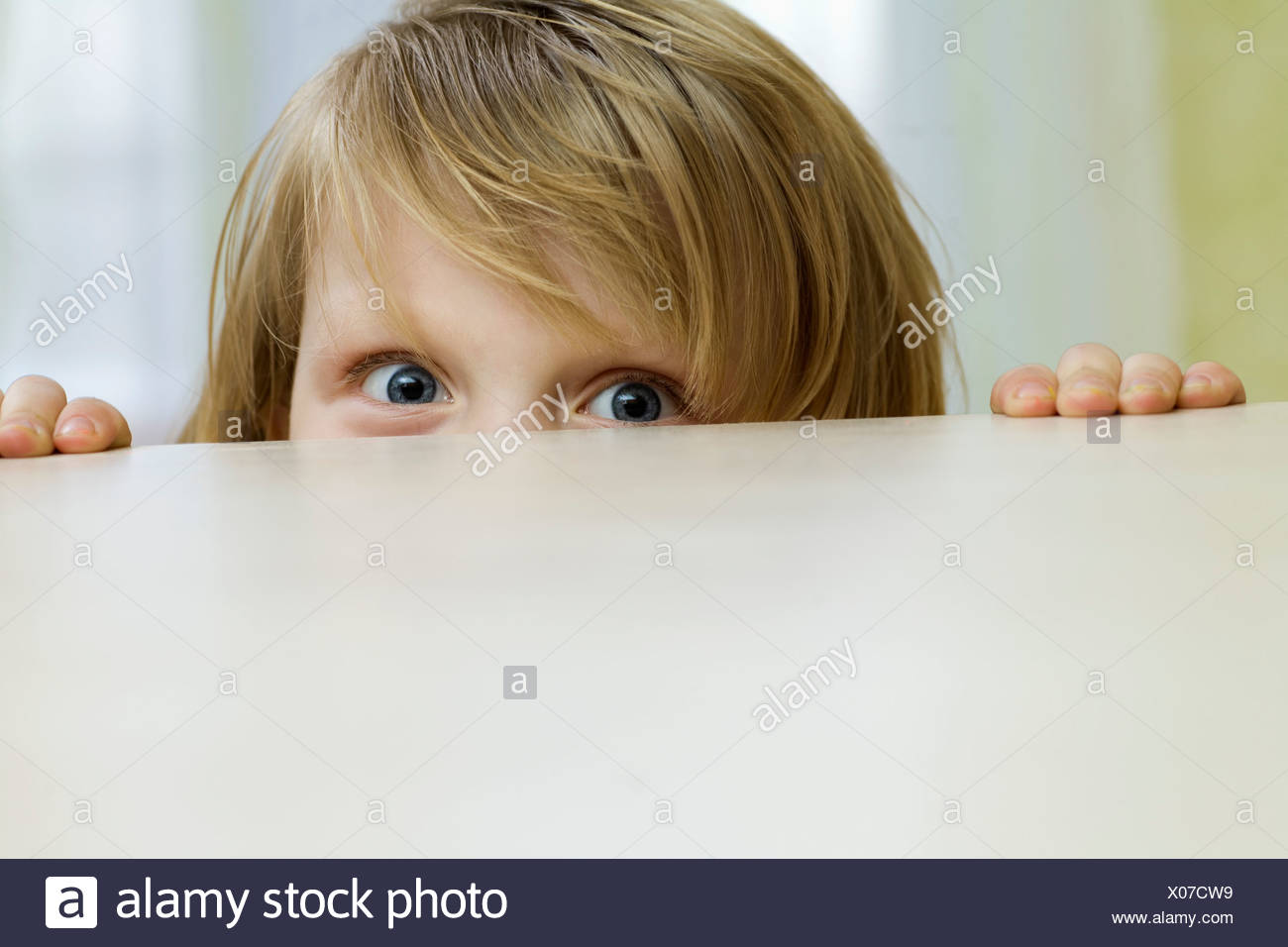 Child Hiding Under Table Stock Photos & Child Hiding Under Table Stock ...