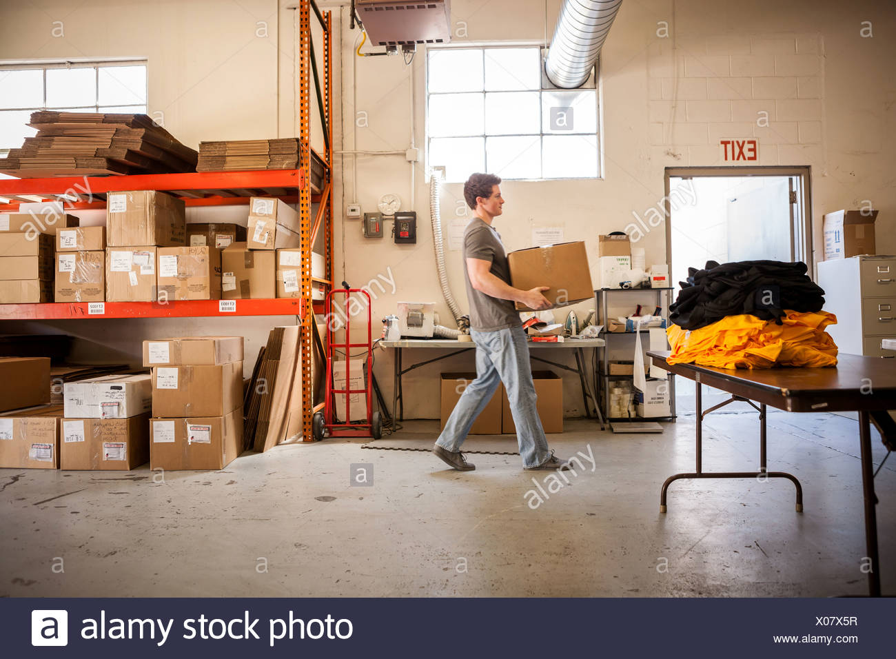 Man Carrying Box High Resolution Stock Photography and Images - Alamy
