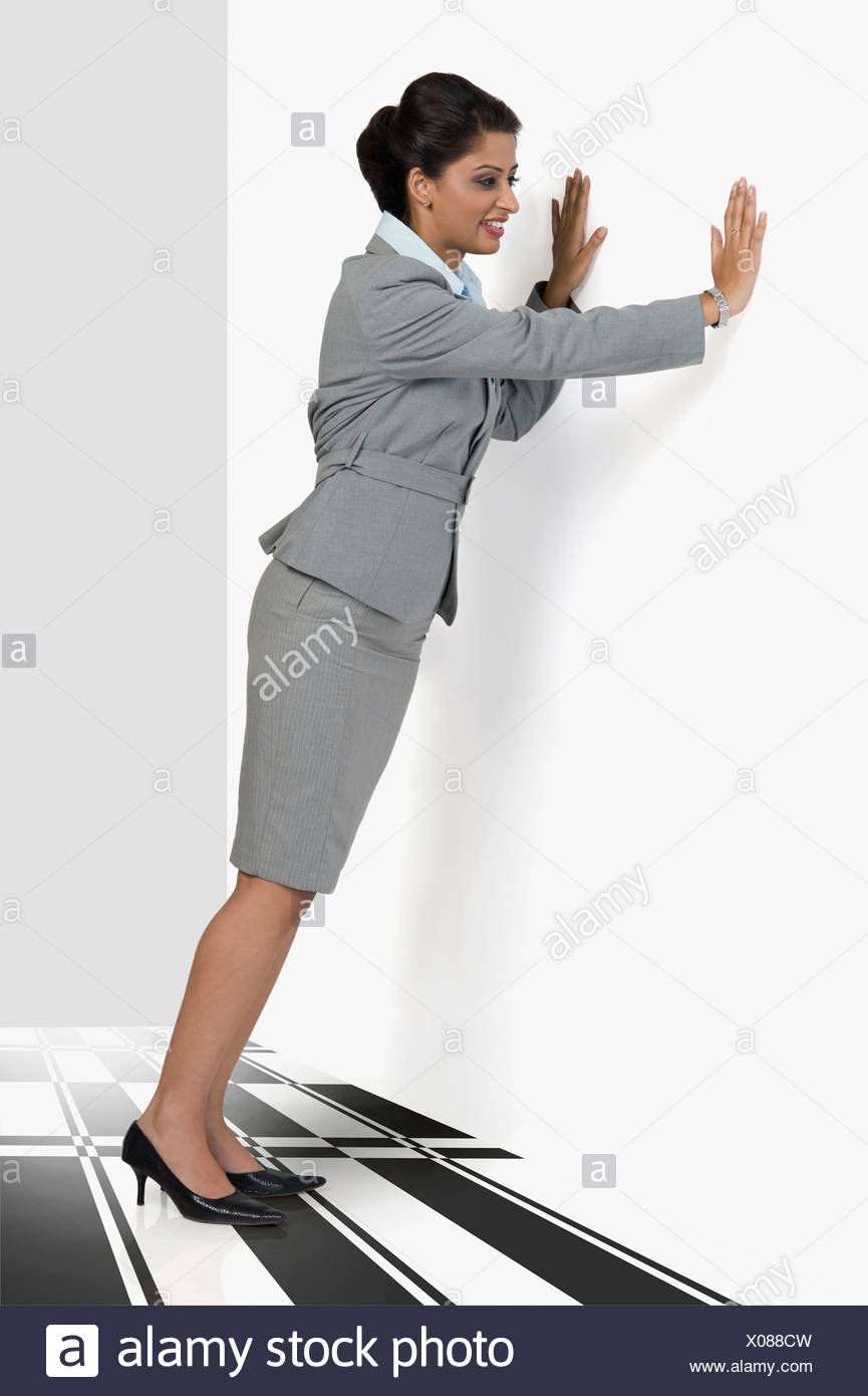 Pushing Against Wall High Resolution Stock Photography and Images - Alamy