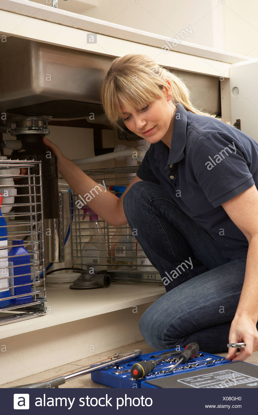 Woman Plumber Working Sink High Resolution Stock Photography and Images ...