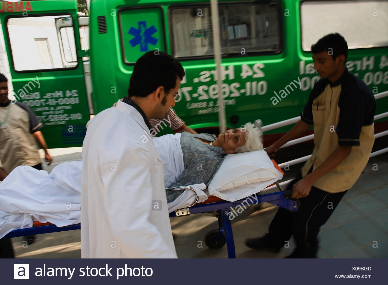 Doctor Rushing Elderly Patient Hospital High Resolution Stock ...
