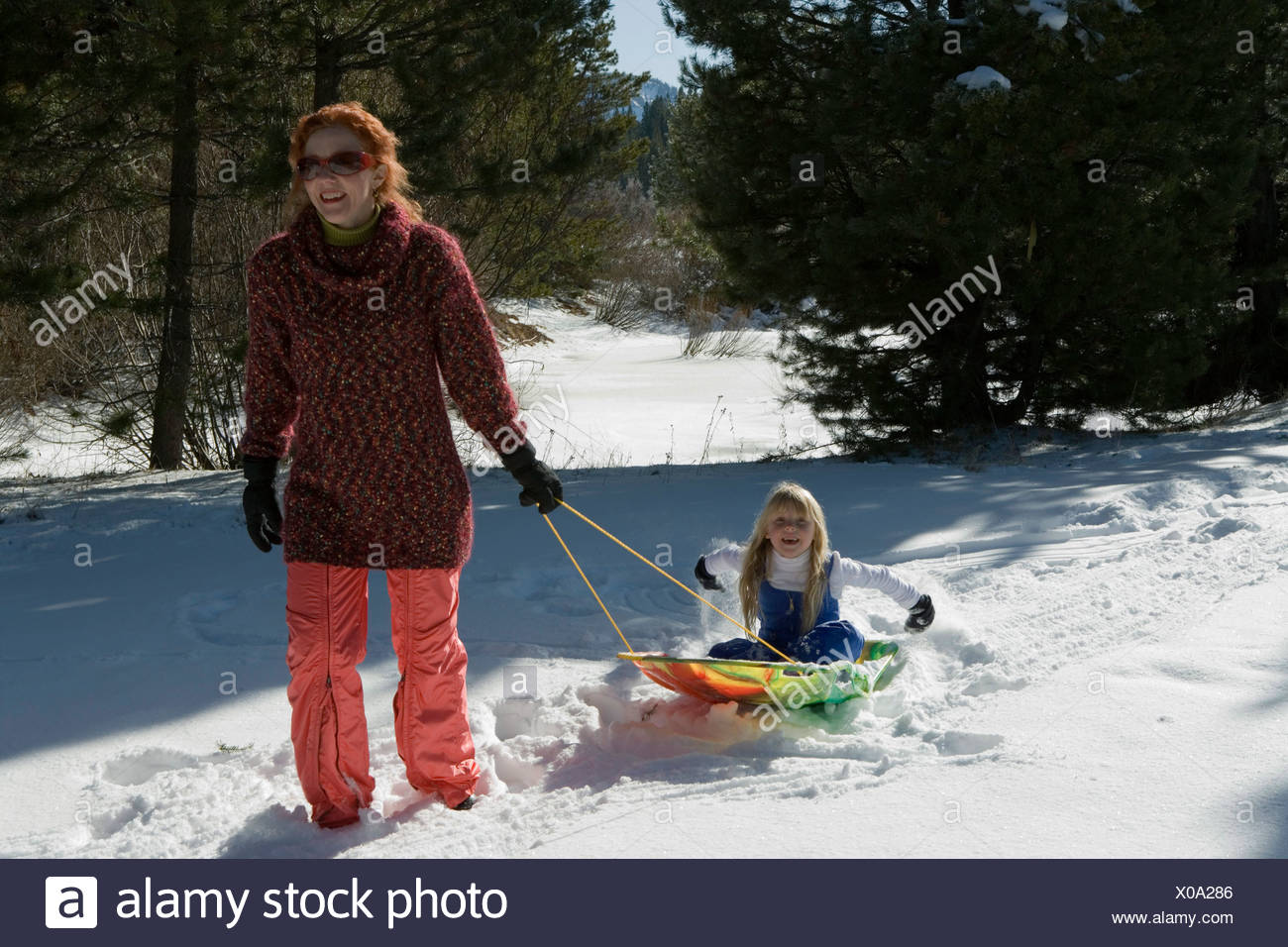 Mother Daughter Sitting On Sled High Resolution Stock Photography and ...