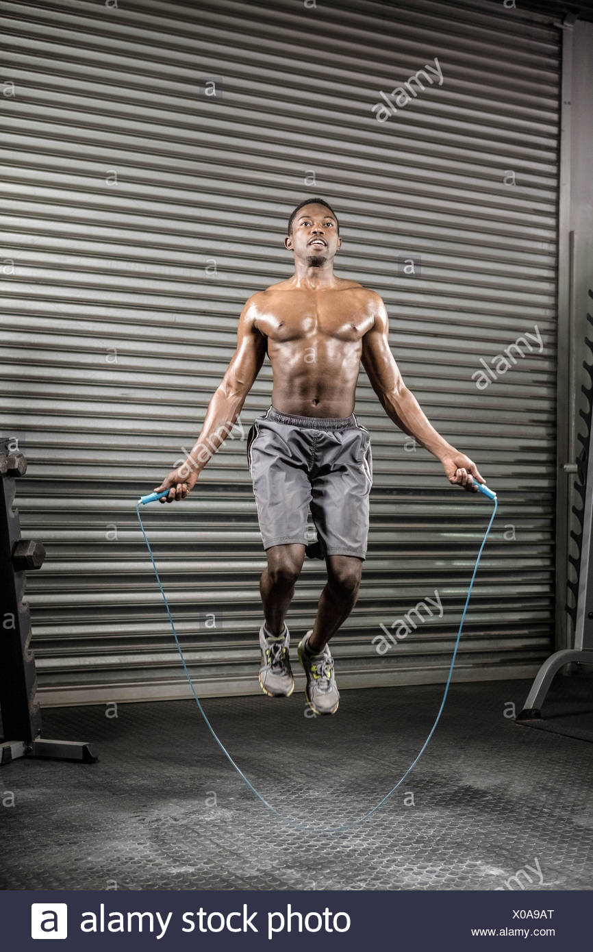 Exercise Young Man Gym Jump Stock Photos & Exercise Young Man Gym Jump ...