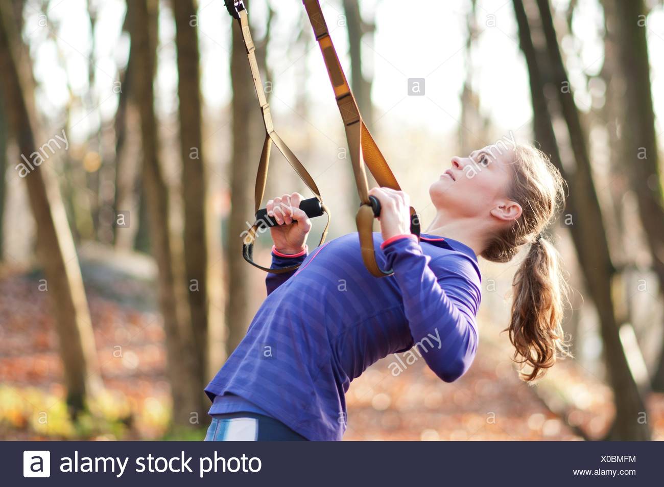 Young Woman Bending Over Outdoors Stock Photos & Young Woman Bending ...