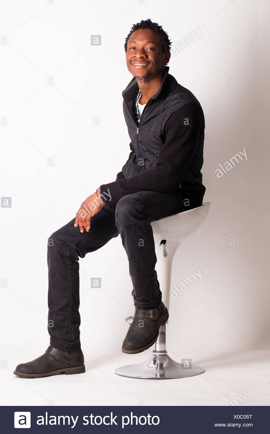 Black Guy Sitting High Resolution Stock Photography and Images - Alamy