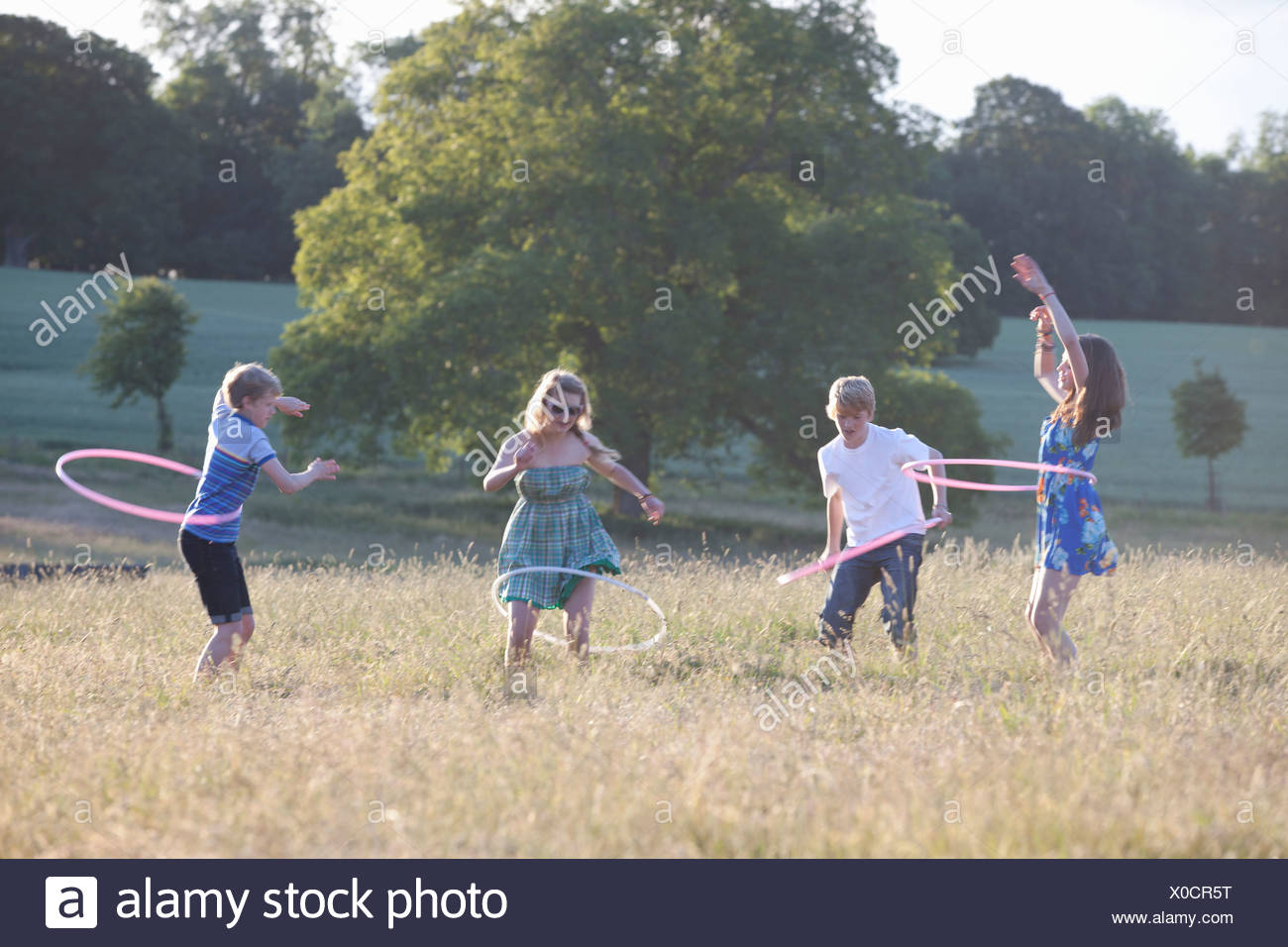 Children Playing Hula Hoops Stock Photos & Children Playing Hula Hoops ...