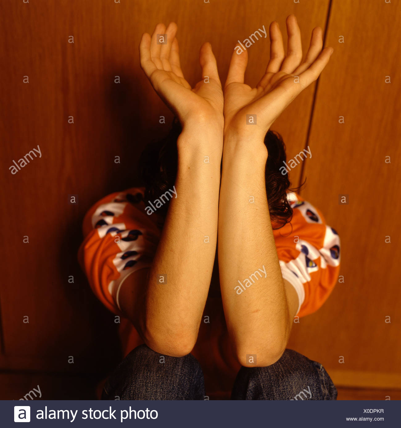 Man Crouching Scared High Resolution Stock Photography and Images - Alamy