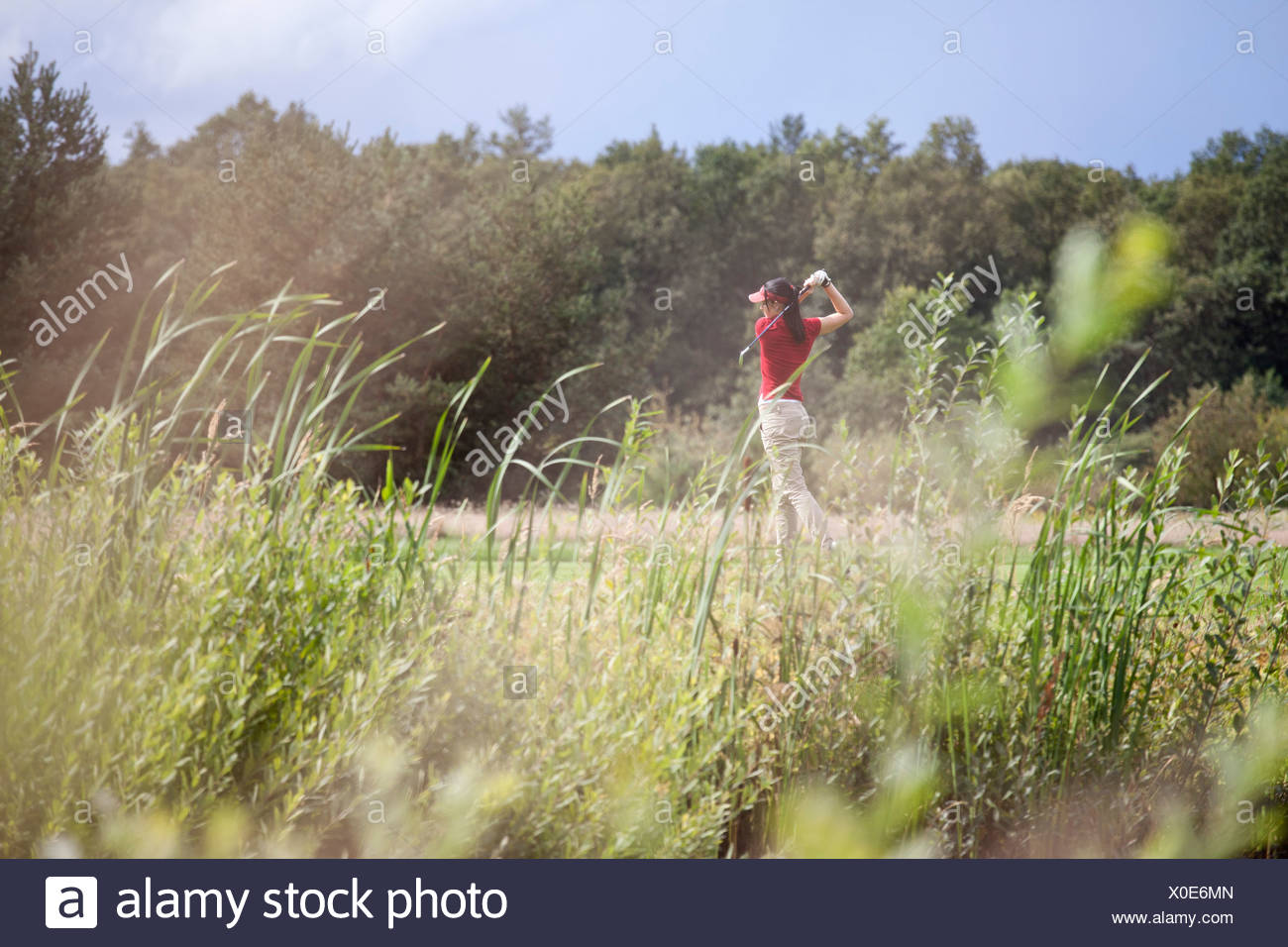 A Female Golfer Teeing Off Stock Photos & A Female Golfer Teeing Off ...