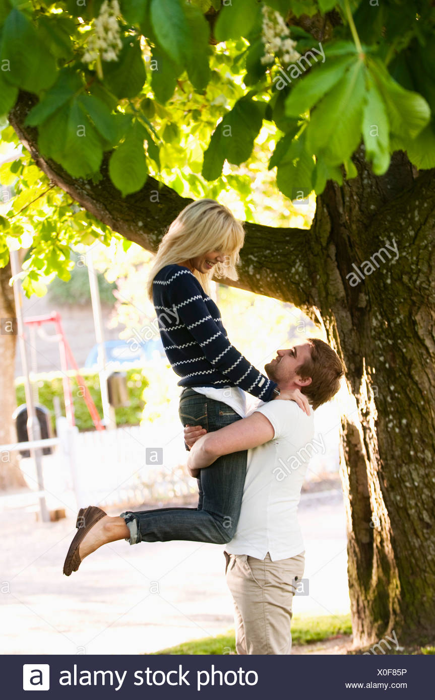 Man Lifting Up Woman High Resolution Stock Photography and Images - Alamy