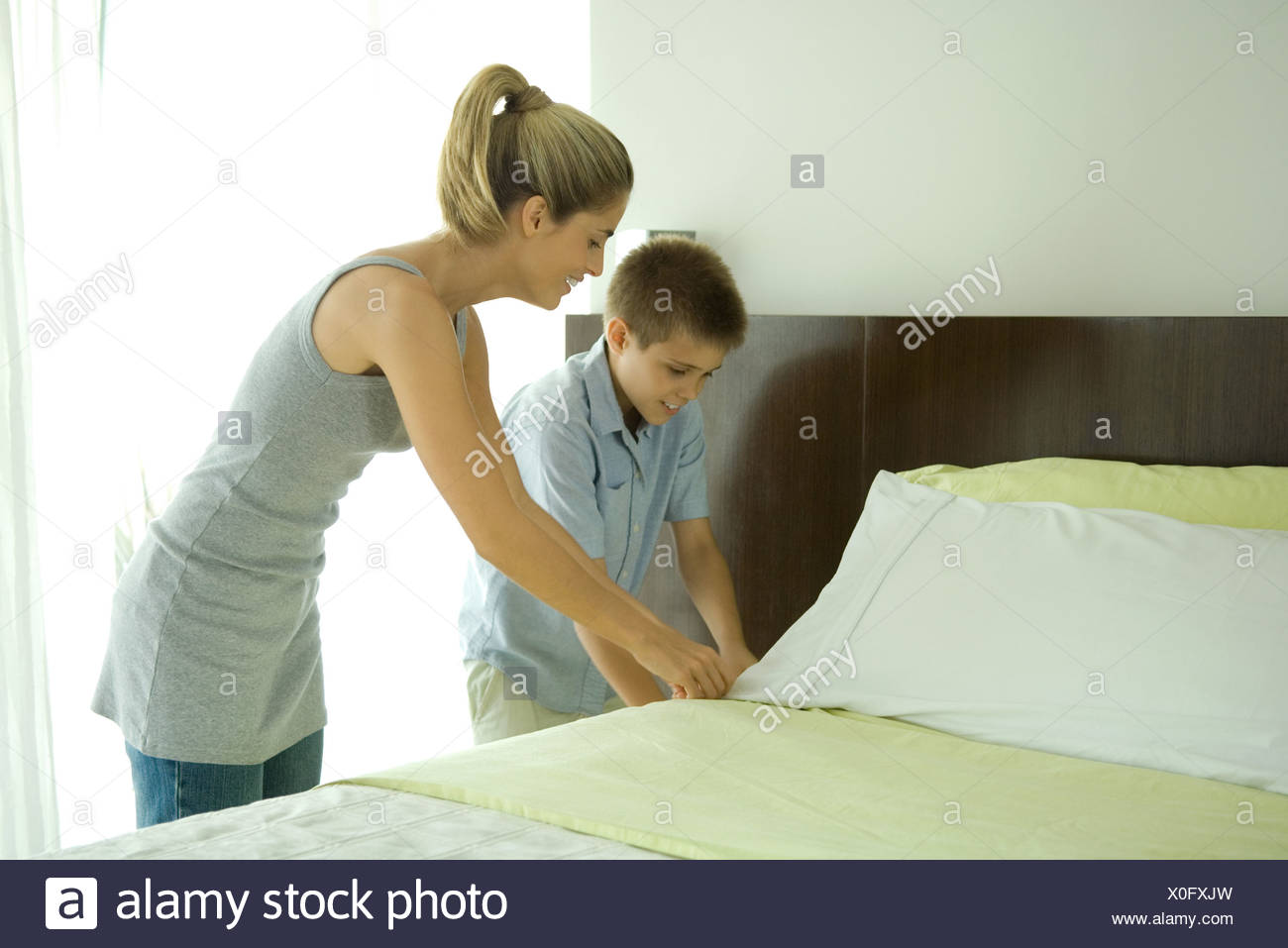 Kid Make Bed Chore High Resolution Stock Photography and Images - Alamy