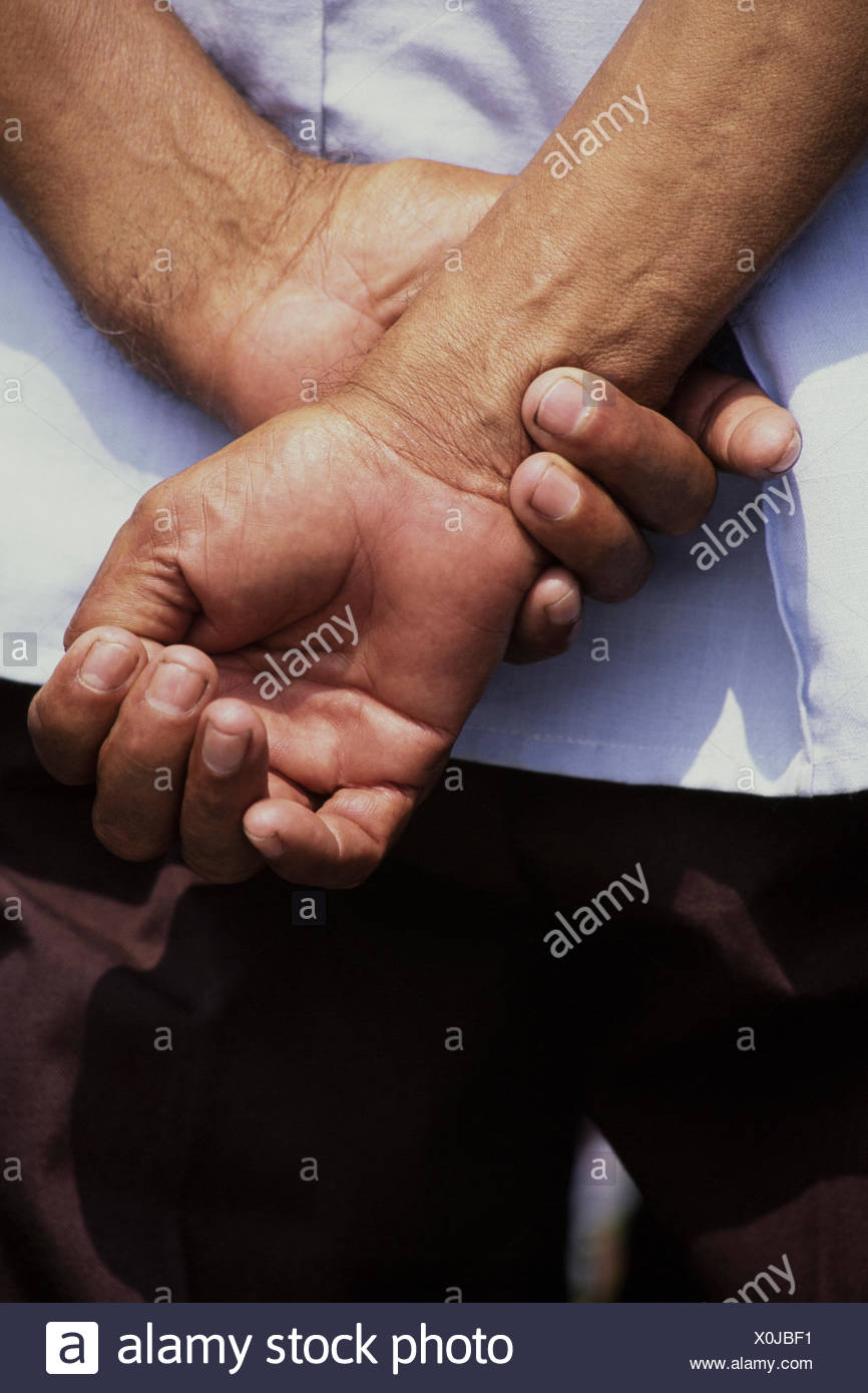 Hands Clasped Behind Back High Resolution Stock Photography and Images - Alamy