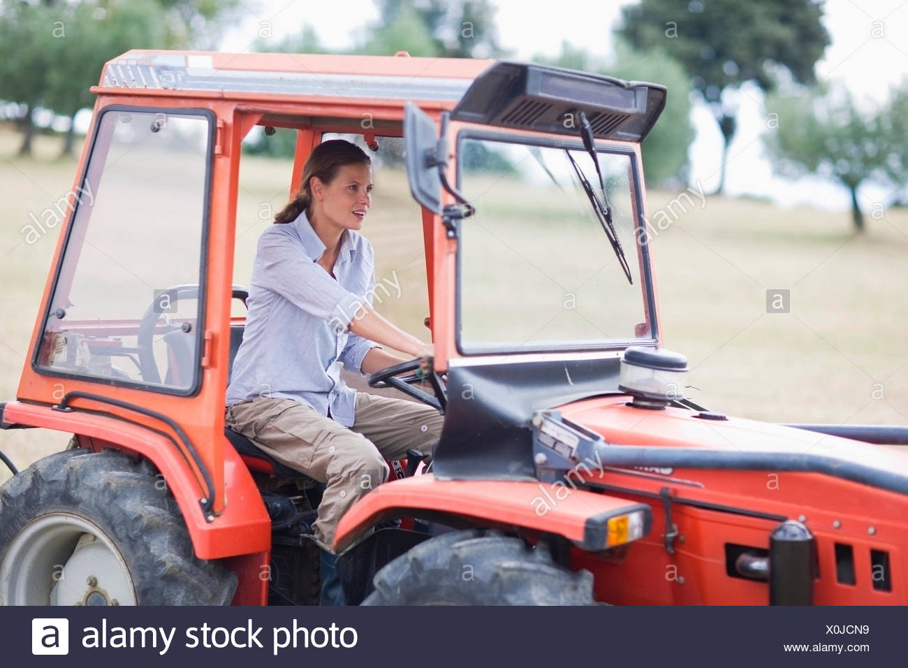Girl Driving Tractor Stock Photos & Girl Driving Tractor Stock Images ...