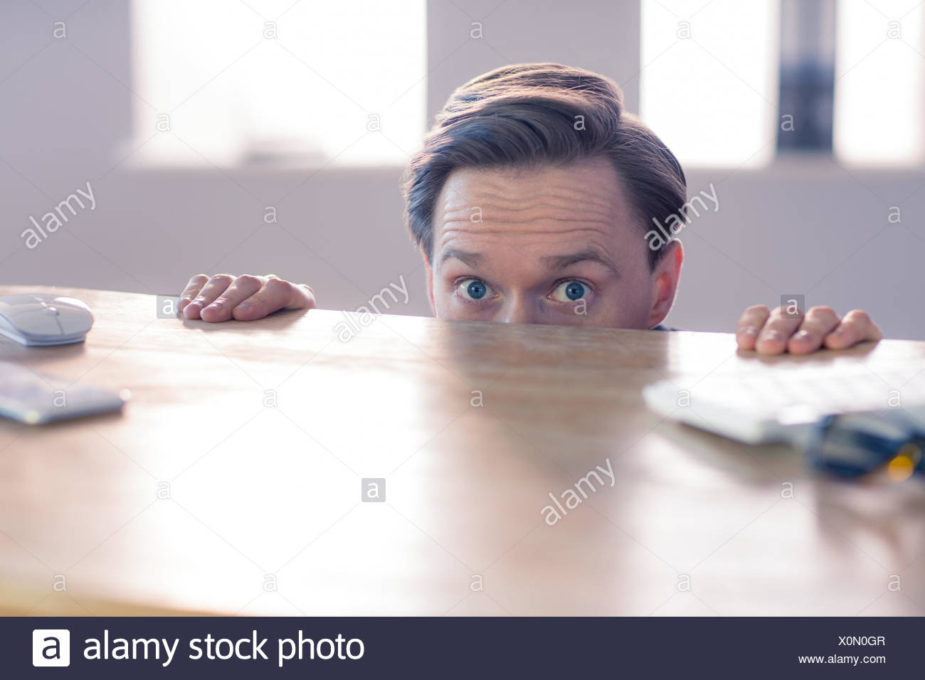 Peeking Over Desk High Resolution Stock Photography and Images - Alamy